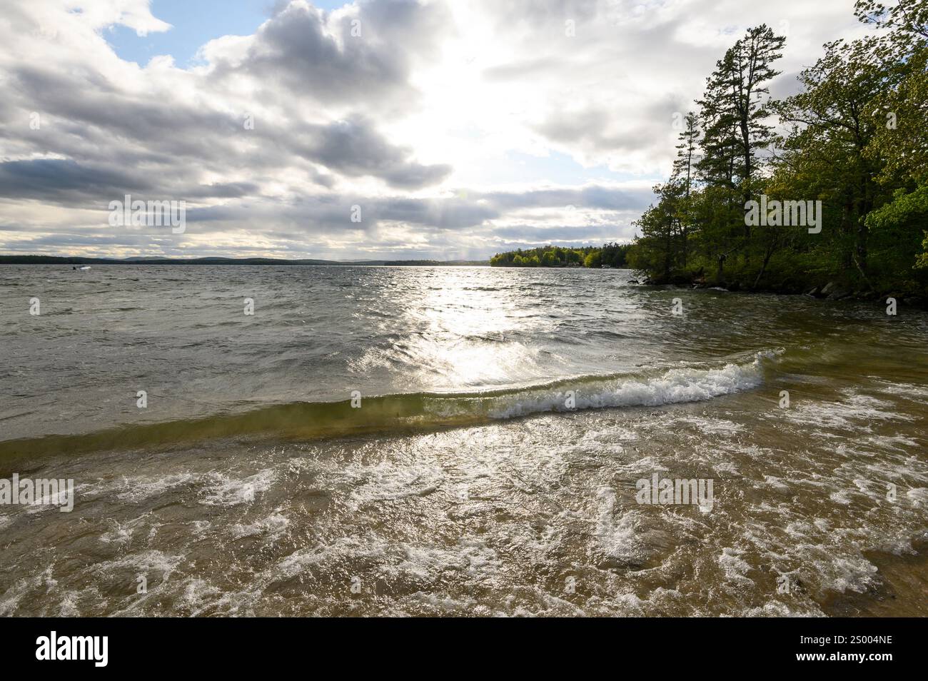 A mix of sun and clouds in the skies over Lake Winnipesaukee, the ...