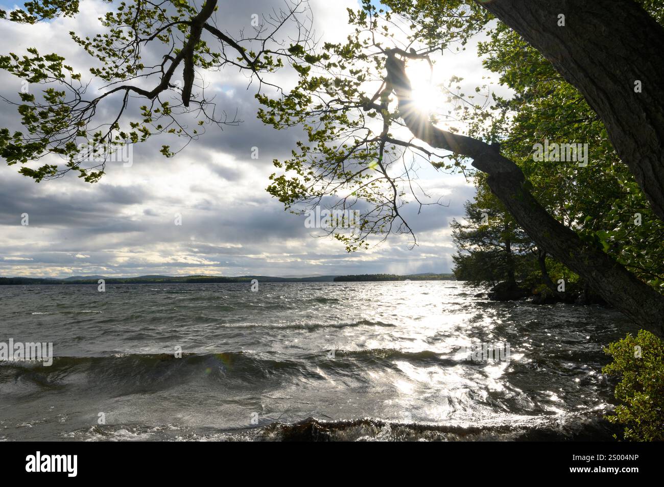 A mix of sun and clouds in the skies over Lake Winnipesaukee, the ...