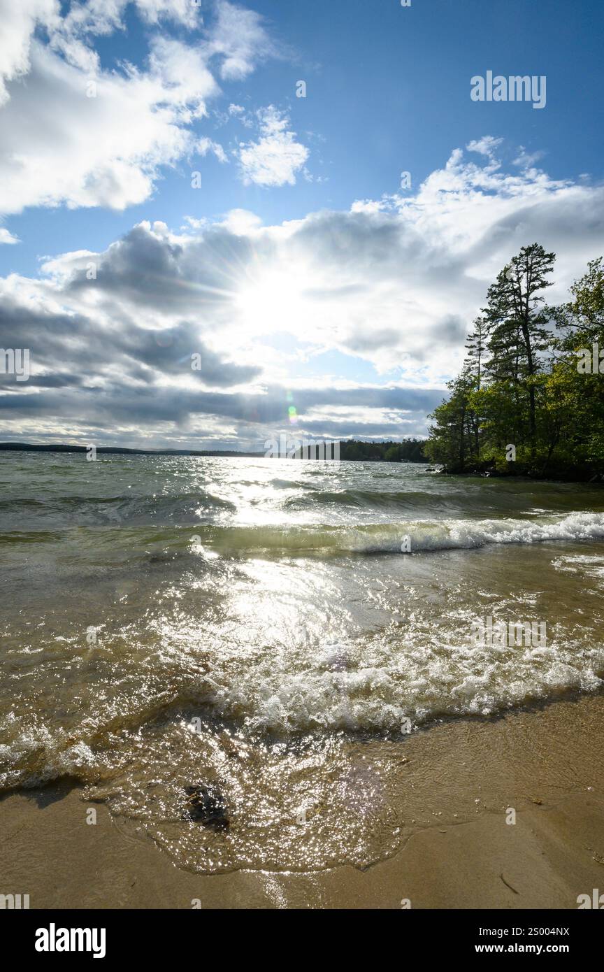 A mix of sun and clouds in the skies over Lake Winnipesaukee, the ...