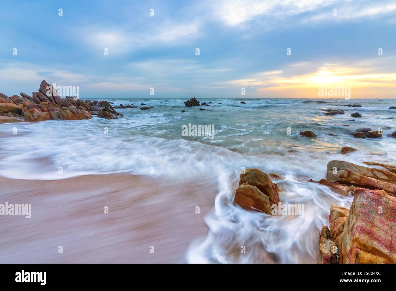 Dreamy dawn landscape on beautiful beach with waves crashing on the ...