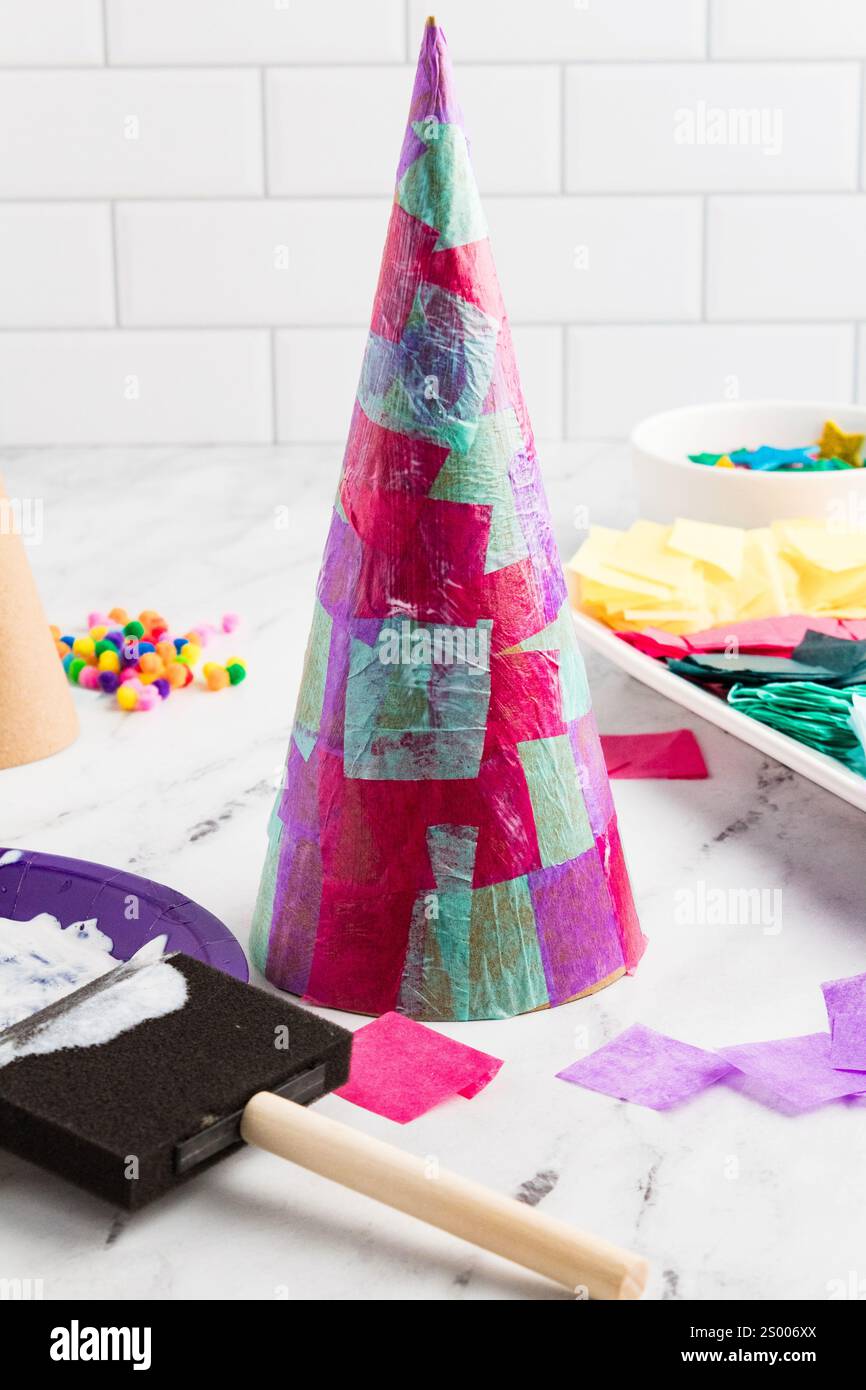 Crafting setup for tissue paper cone Christmas trees Stock Photo - Alamy
