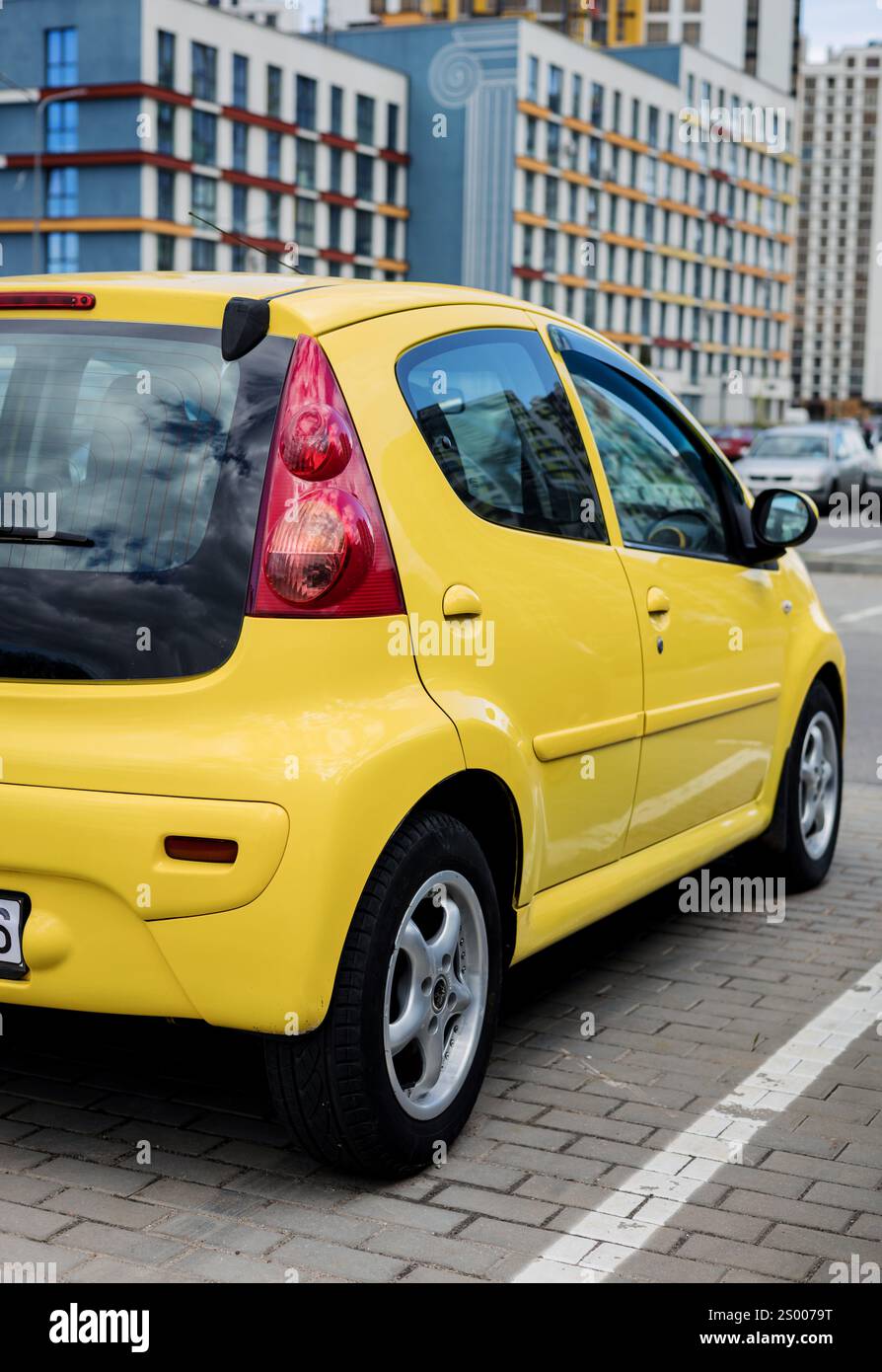 Minsk, Belarus, December 23, 2024 - Part of view compact yellow car ...
