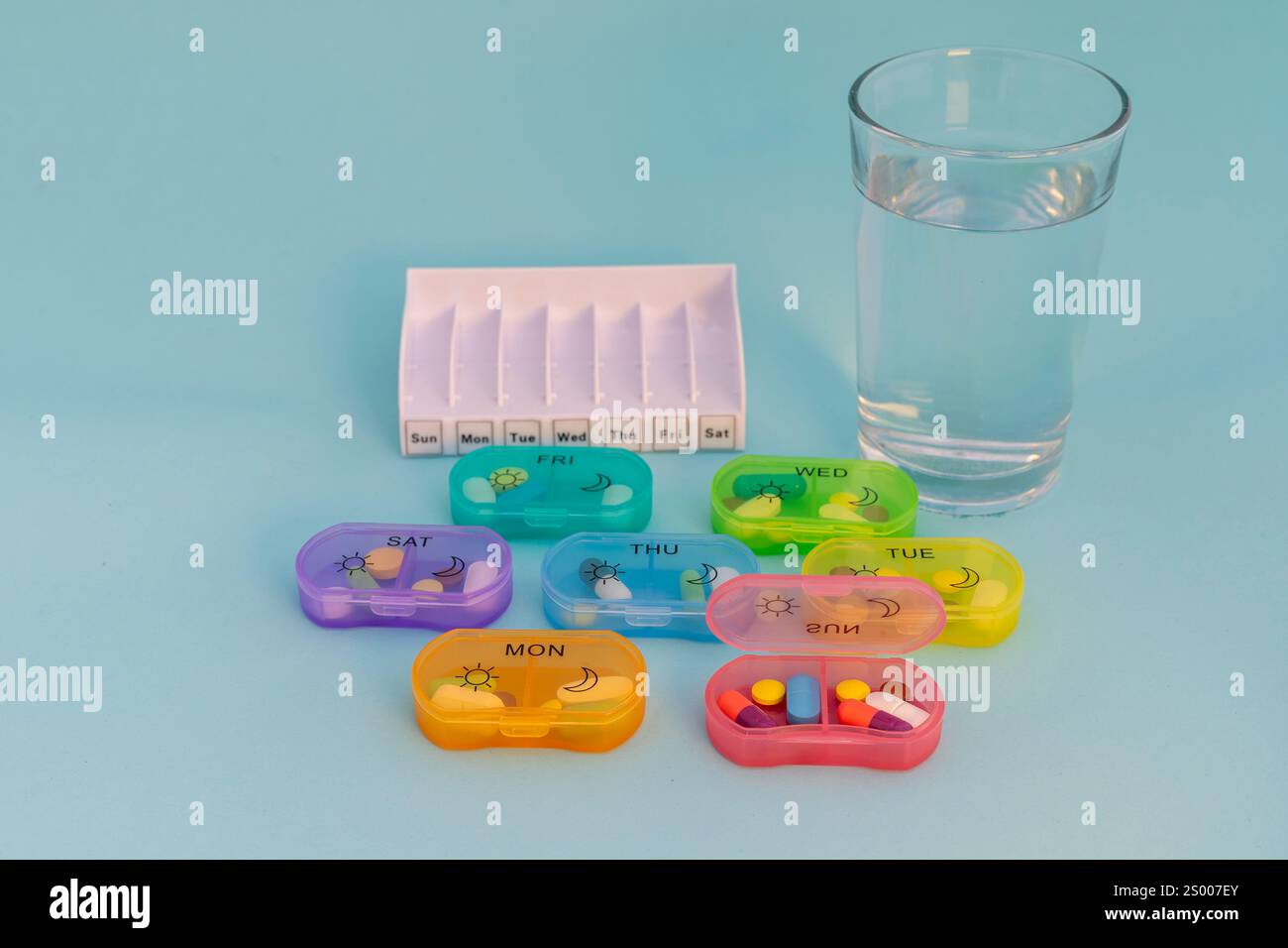 Portable travel pill organizer packed with pills and tablets for entire ...