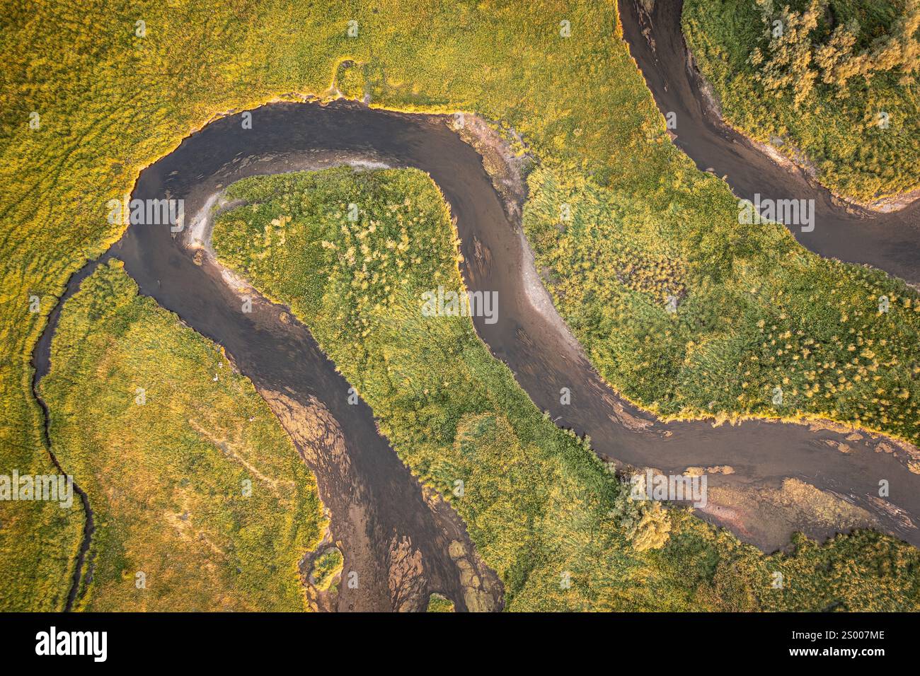 River winding through open field during late summer in Montana Stock ...