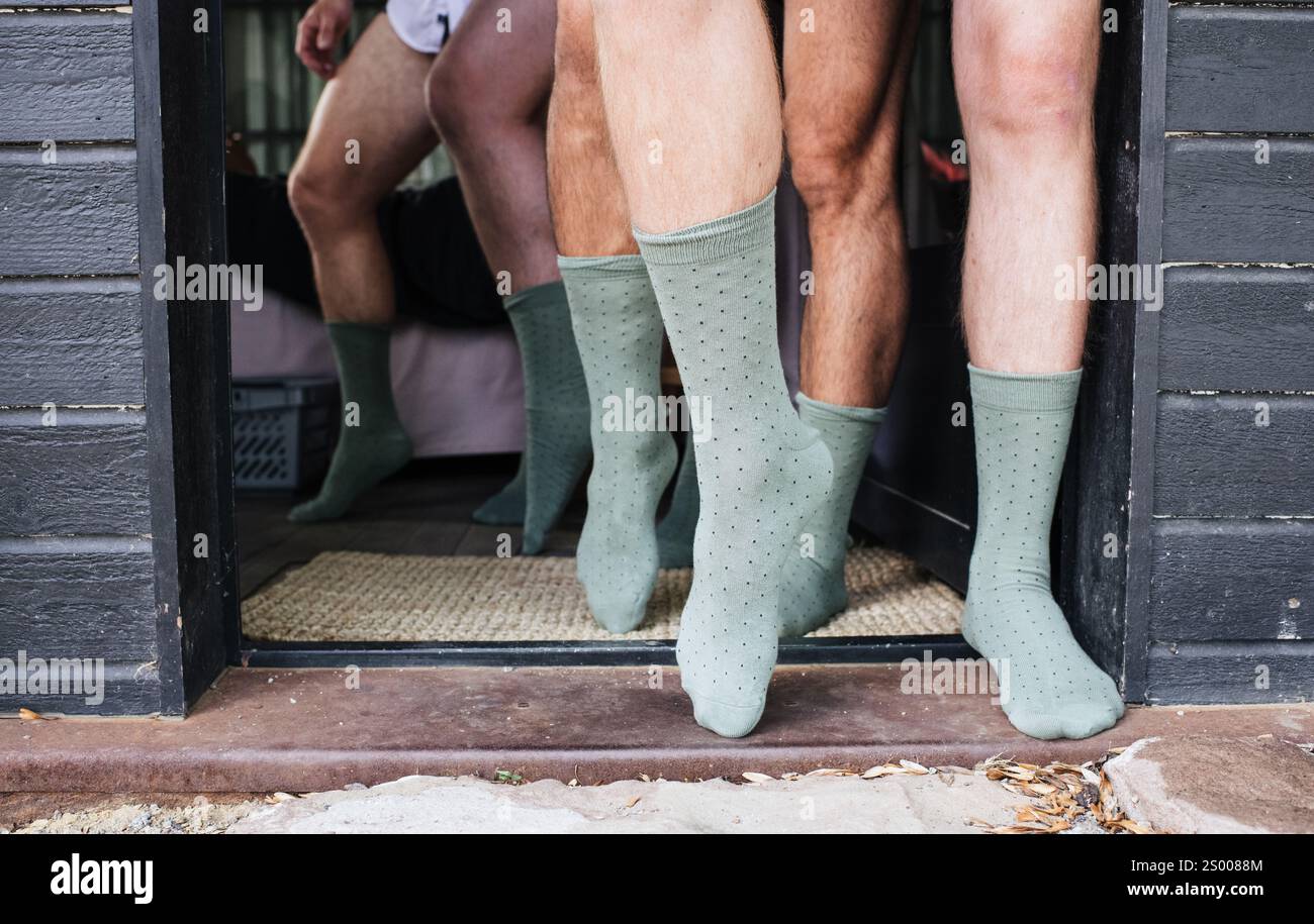 grooms socks and legs getting ready for the wedding day Stock Photo - Alamy