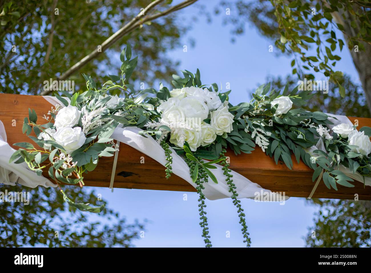 Floral wedding arch decoration with white roses and greenery Stock ...