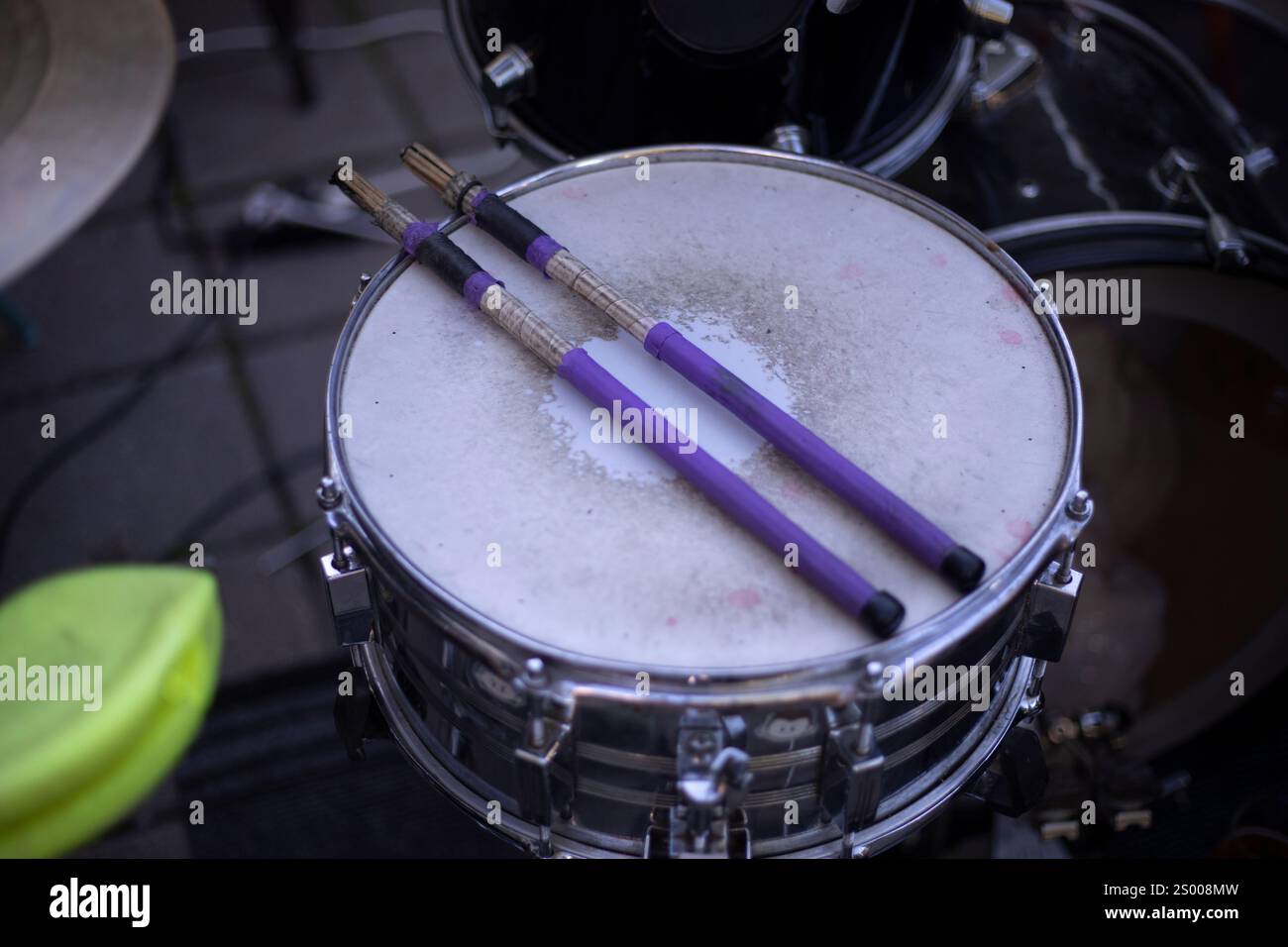 Drumsticks lying on a drum. A percussion musical instrument Stock Photo ...