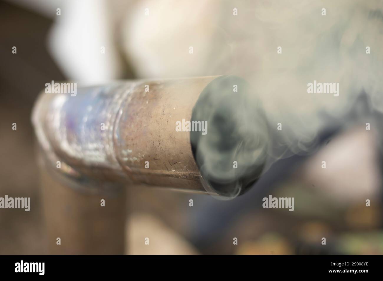 Smoke from a steel pipe. Hot pipe. Smoke from a samovar. Outdoor ...