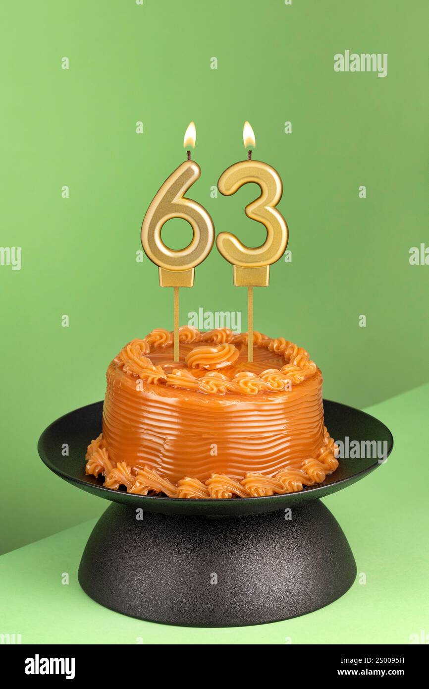 Number 63 birthday candle on a green background - Delicious cake with ...