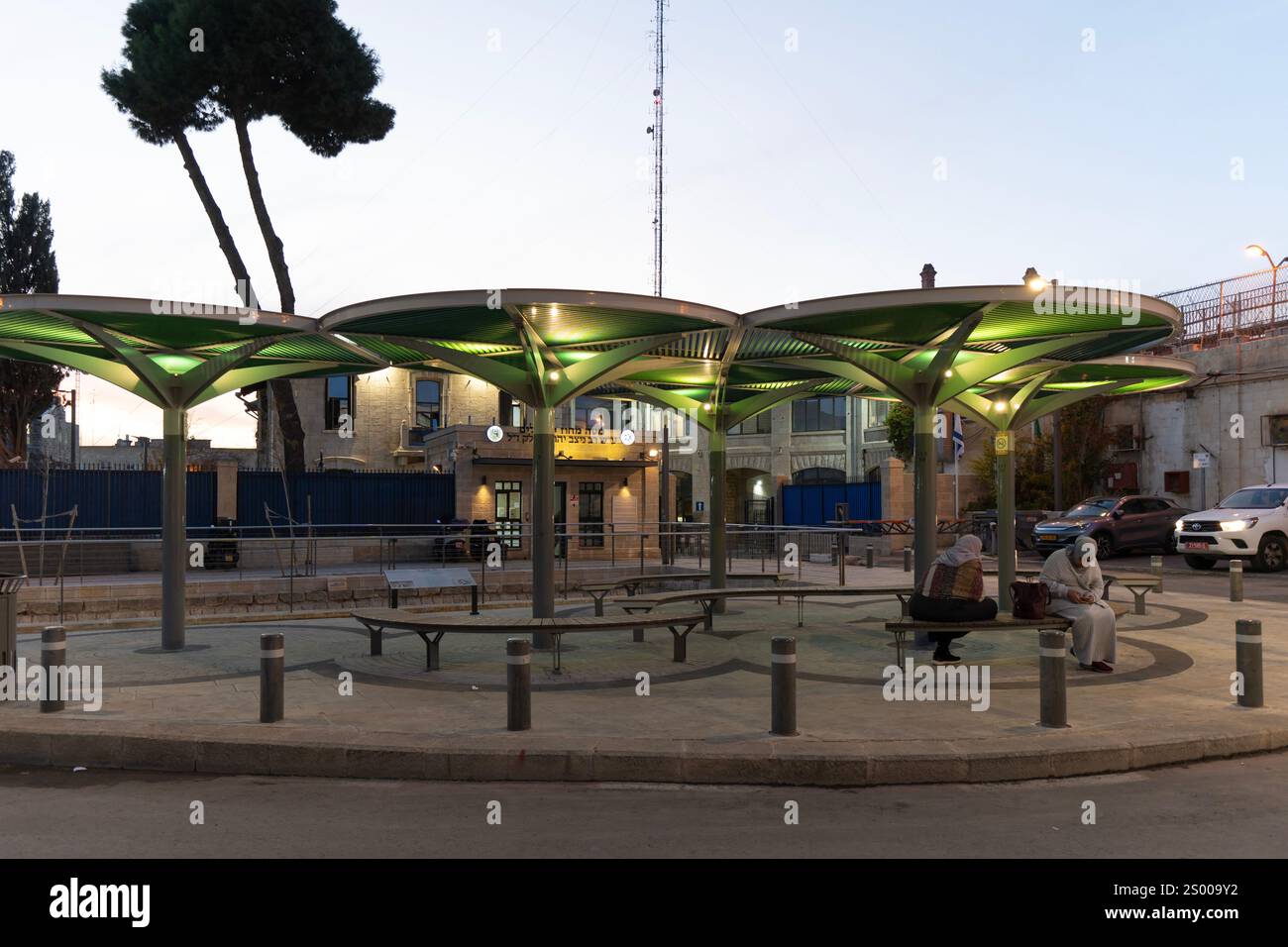 Palestinian women sit outside the detention and interrogation facility ...