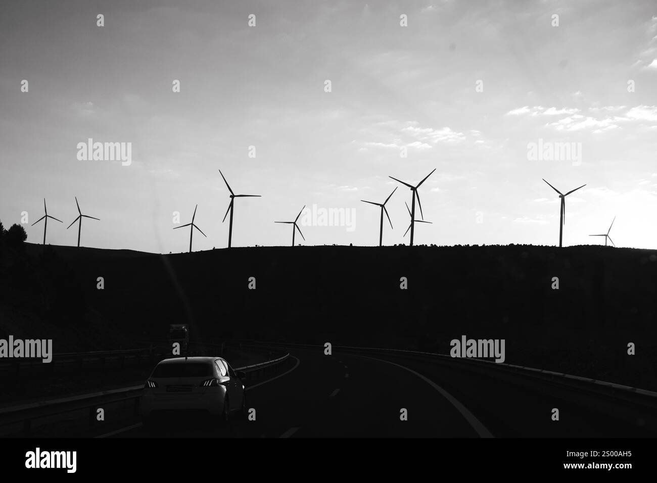 Wind turbines energy generator on wind farm black and white background ...