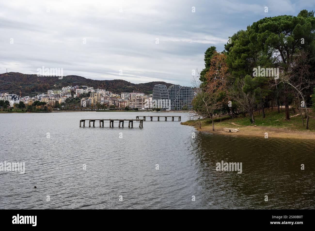 Autumn colors of trees at the shore of the artifical lake and park of ...