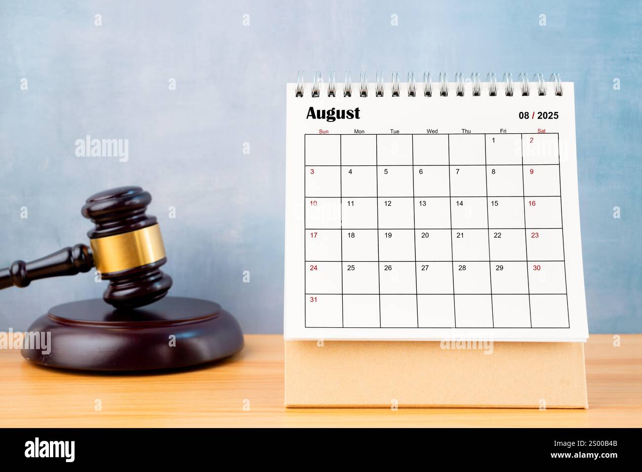 Desk calendar for August 2025 and judge's gavel on the worktable Stock ...