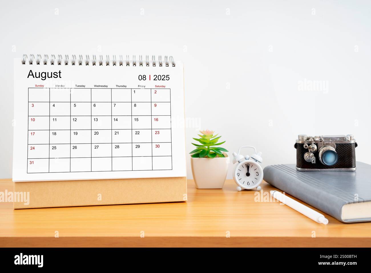 Desktop Calendar for August 2025 year and vintage camera with diary for ...