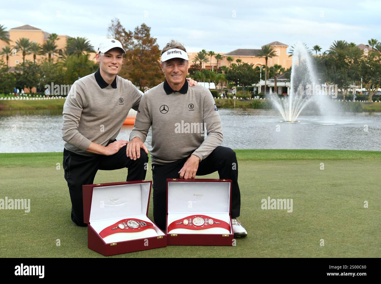Bernhard Langer and his son, Jason Langer pose with their trophies ...