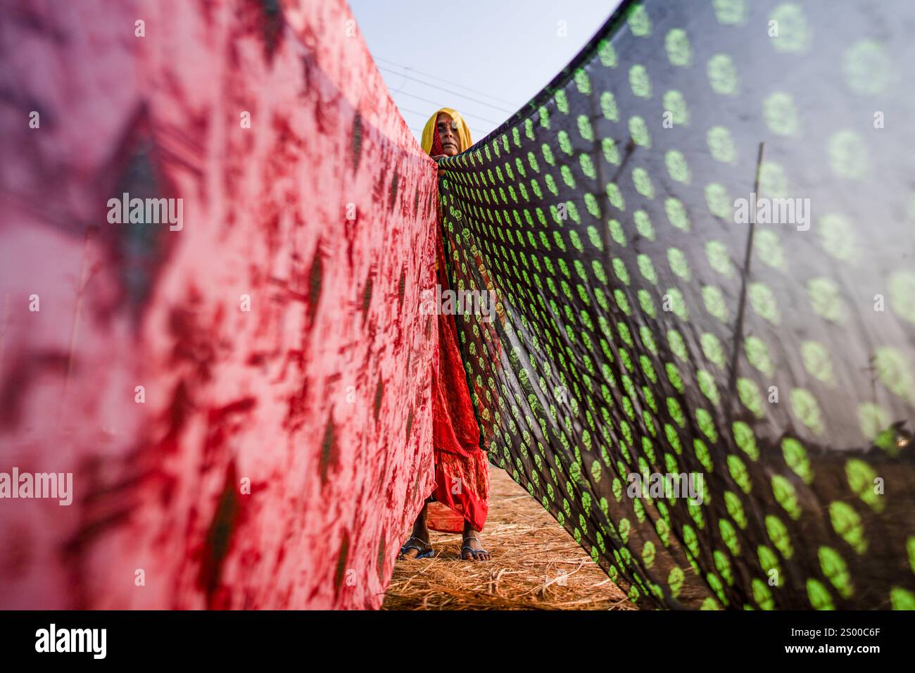 Hindu devotees dry a sari after taking a holy dip at Sangam, ahead of ...