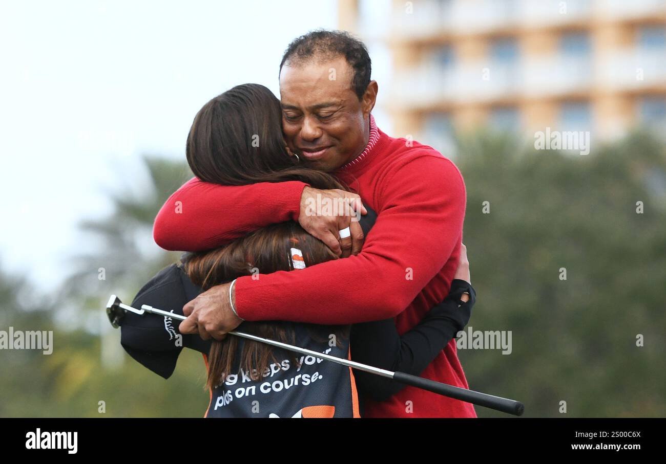 Tiger Woods hugs his daughter, Sam Woods, on the 18th green after ...