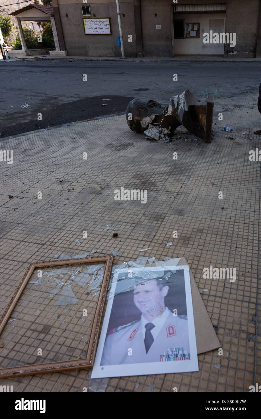 Destroyed statue of Hafez El Assad, inside the ‘security complex or ...