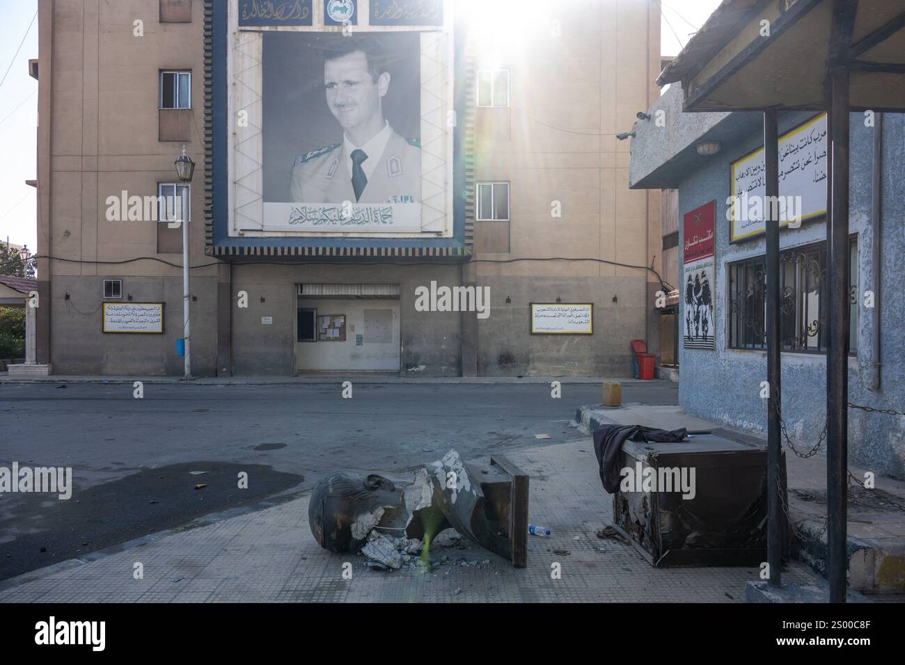 Destroyed statue of Hafez El Assad, inside the ‘security complex or ...