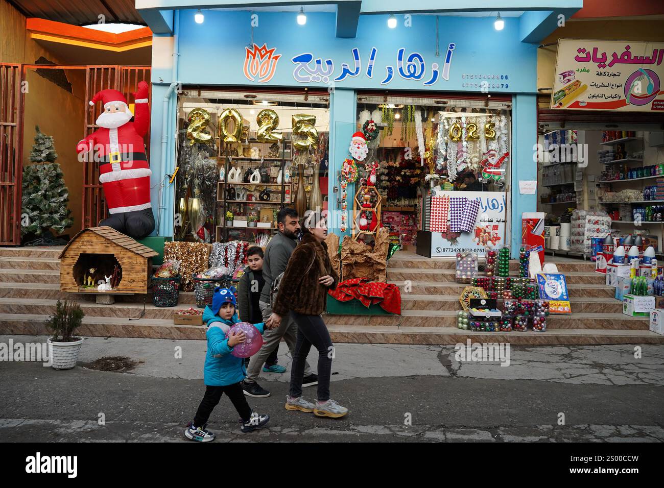 Christians walk in the market looking for Christmas decorations in the ...