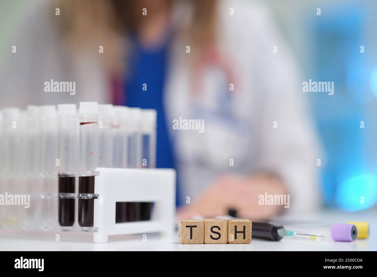 A qualified medical professional is carefully examining blood samples ...