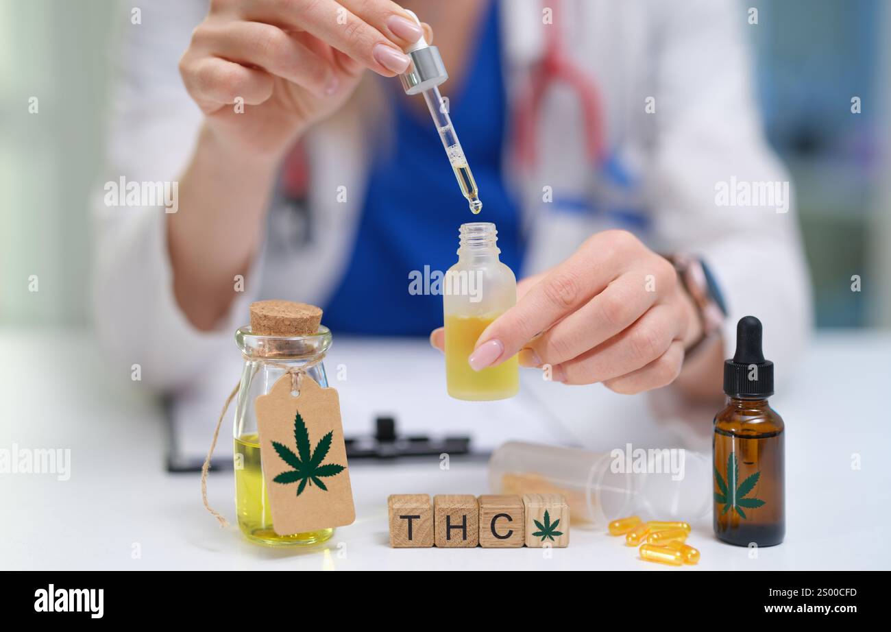 A healthcare expert is demonstrating the process of THC oil extraction ...