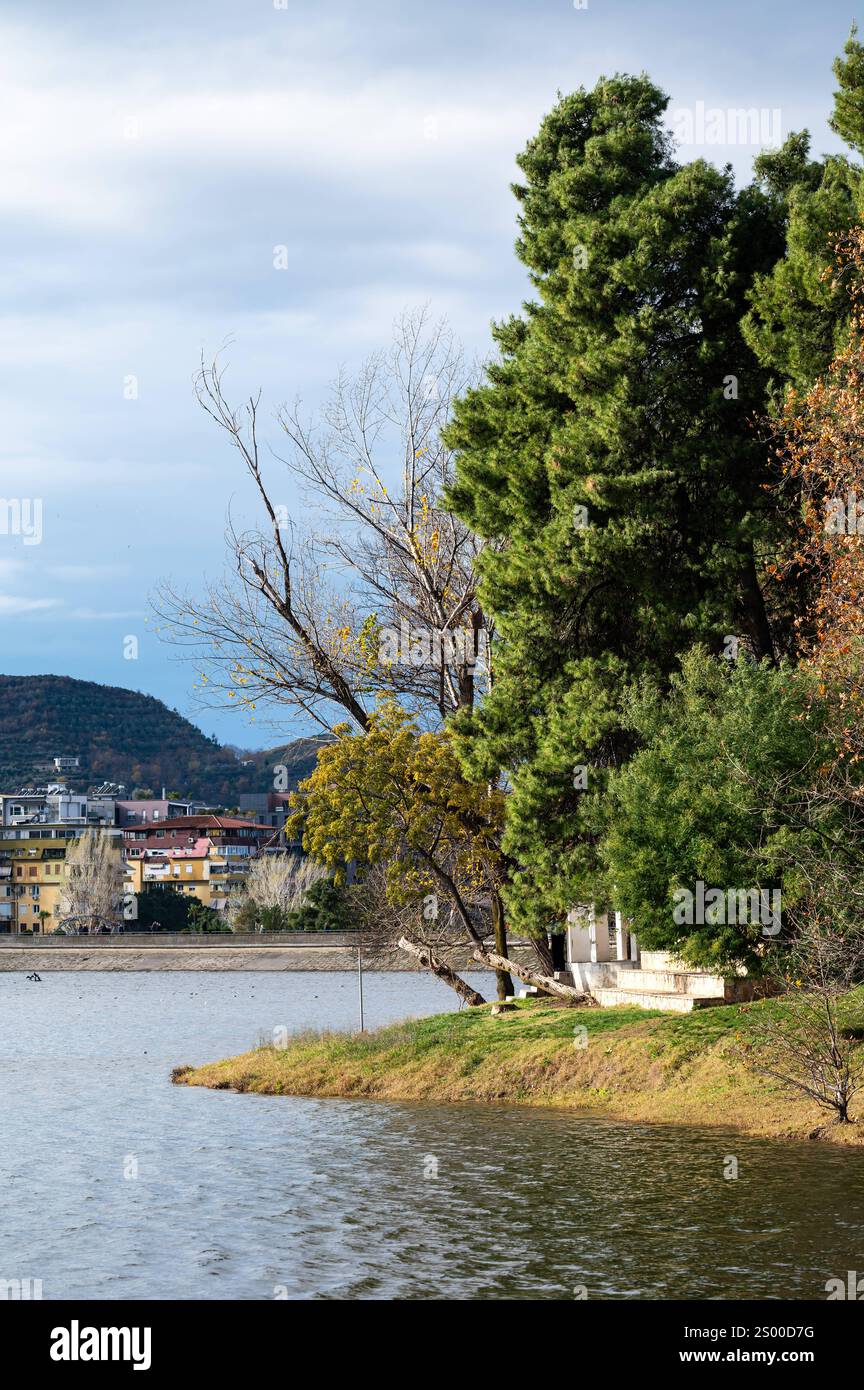 Colorful autumn trees at the recreation zone and shore of the artifical ...