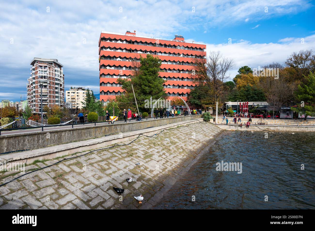 Colorful autumn trees at the recreation zone and shore of the artifical ...