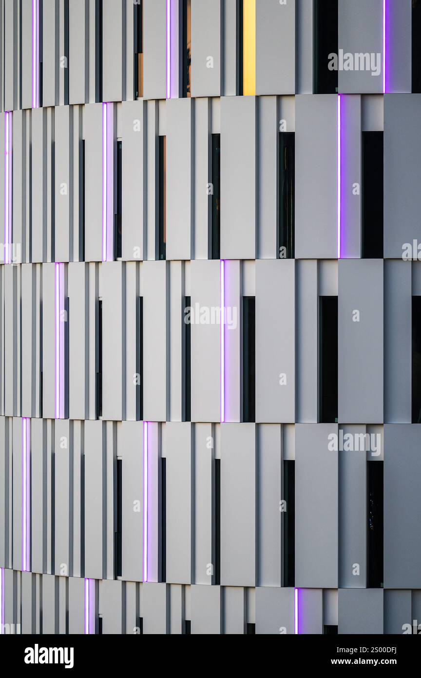 Contemporary abstract patterns of a high rise building by night in ...