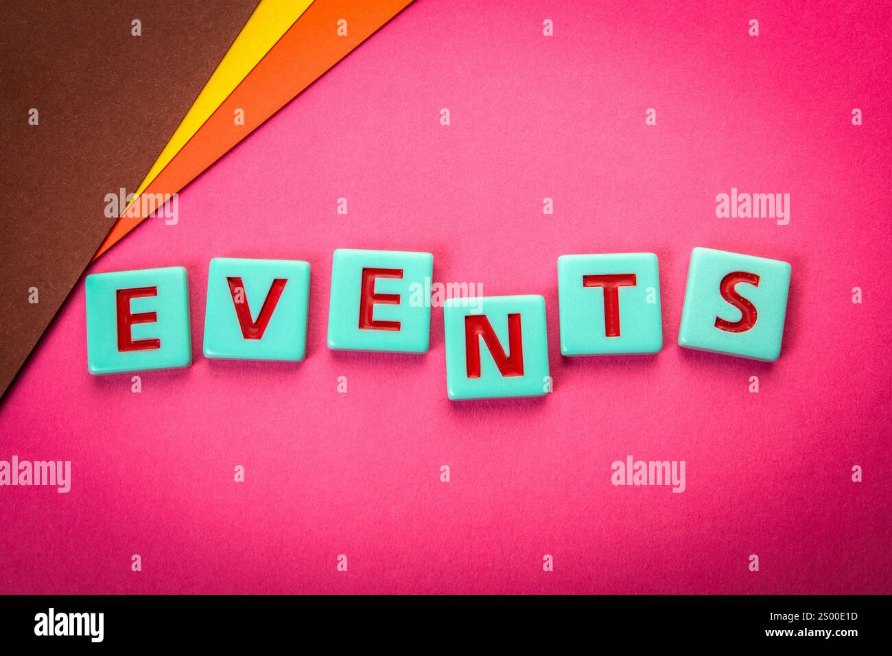 EVENTS. Alphabet letter tiles on a red textured background Stock Photo ...