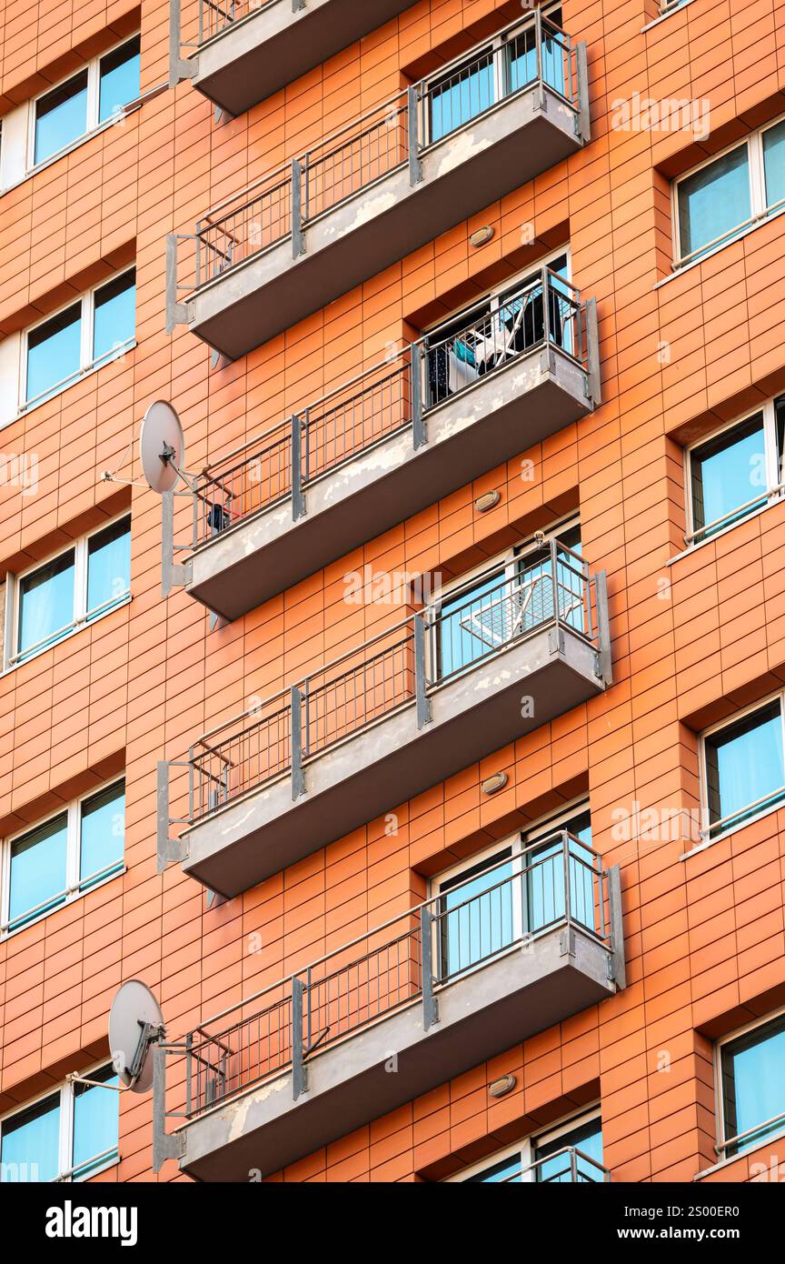 Residential orange colored high rise apartment block in Tirana, Albania ...