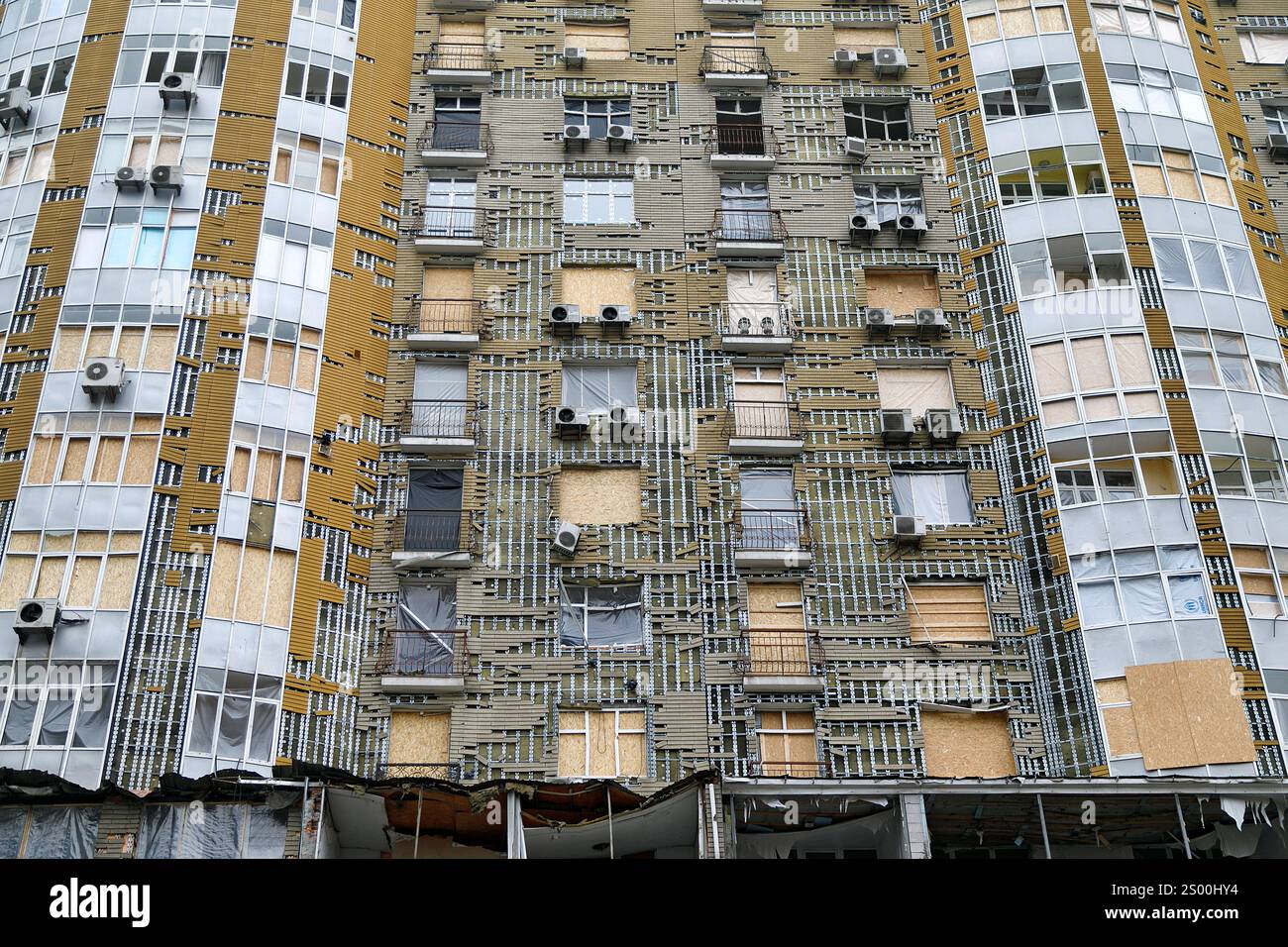 KYIV, UKRAINE - DECEMBER 23, 2024 - OSB boards seal windows at an ...