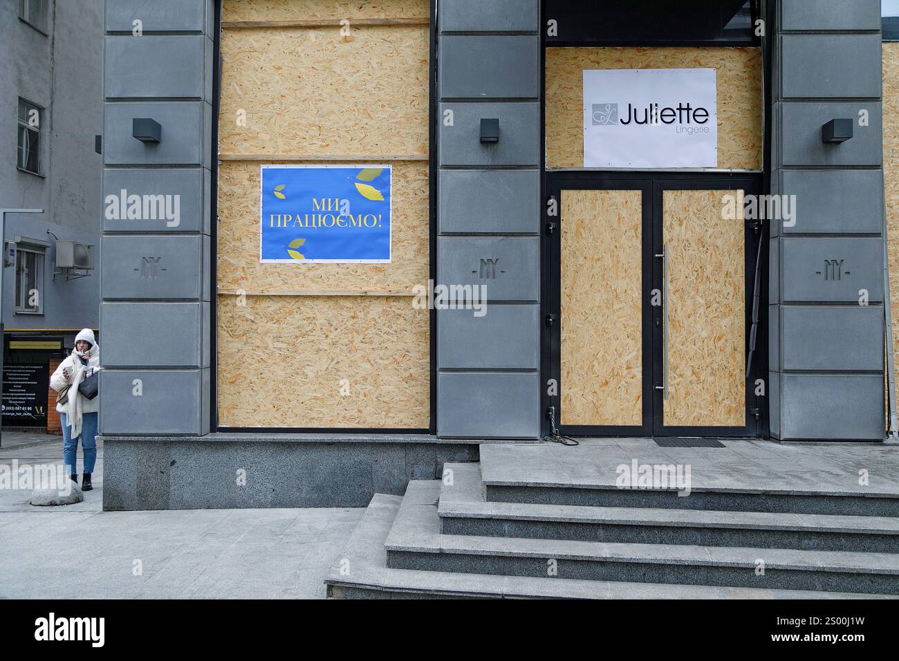 KYIV, UKRAINE - DECEMBER 23, 2024 - OSB boards seal the windows and ...