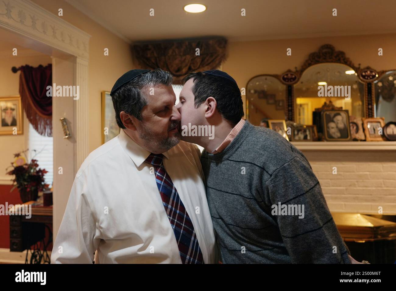 Dov Marcus, right, kisses his father, Robert Marcus, in Teaneck, N.J ...