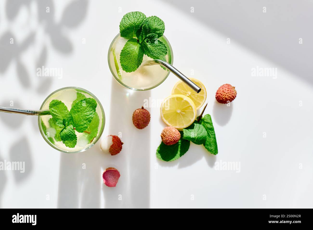 Refreshing lychee drink with lime, mint leaves and ice. Non-alcoholic sparkling cocktail fizzy ...