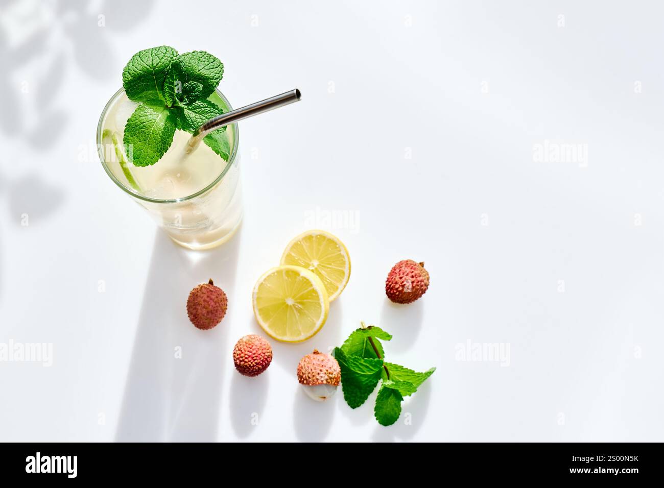 Refreshing lychee drink with lime, mint leaves and ice. Non-alcoholic sparkling cocktail fizzy ...