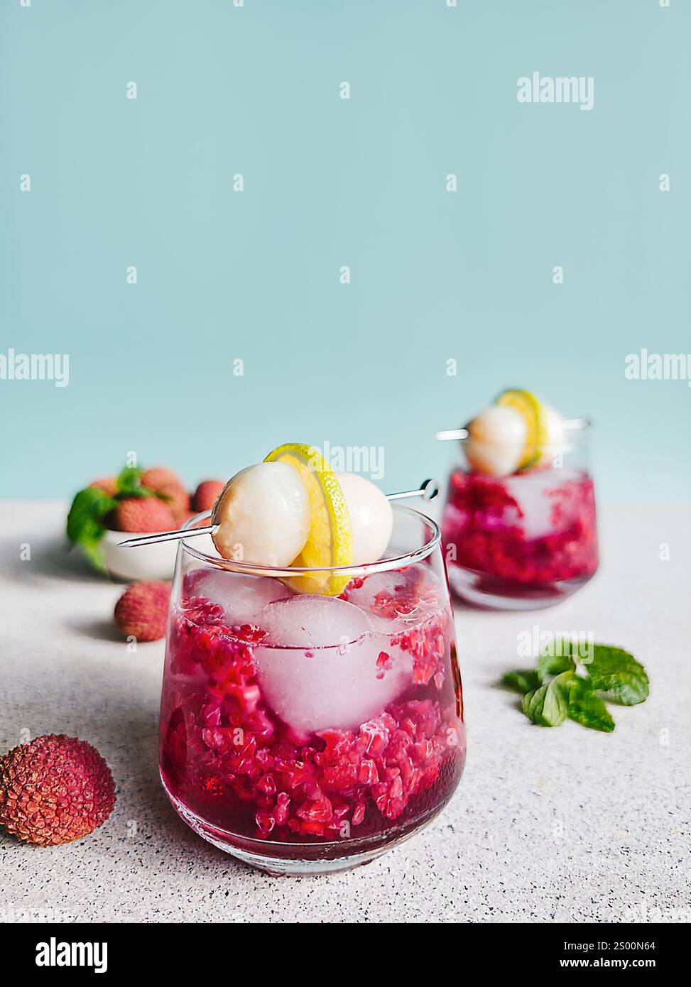 Refreshing lychee drink with raspberry, lime, mint leaves and ice. Non-alcoholic sparkling ...