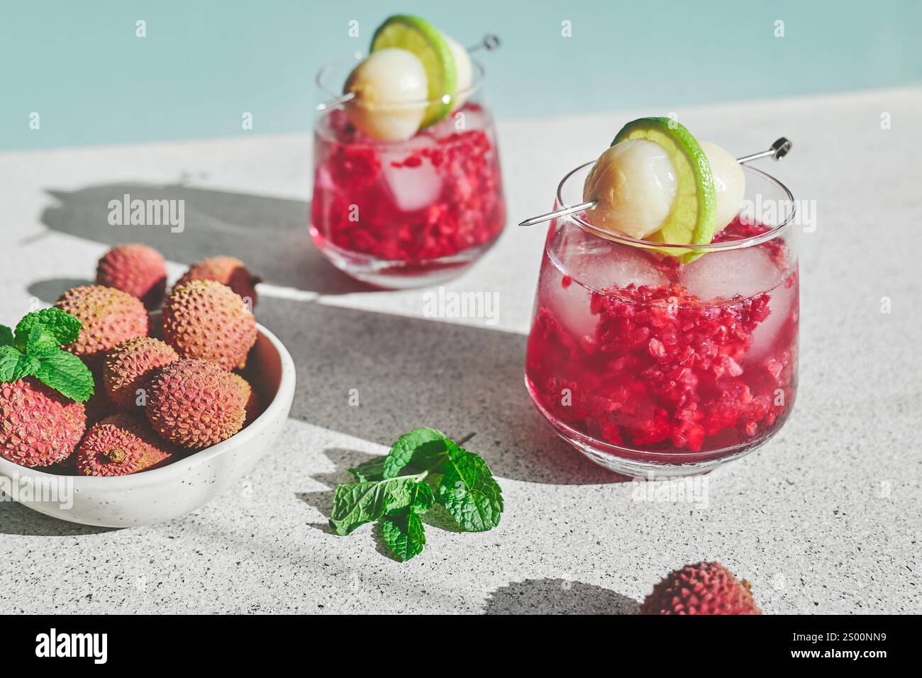 Refreshing lychee drink with raspberry, lime, mint leaves and ice. Non-alcoholic sparkling ...