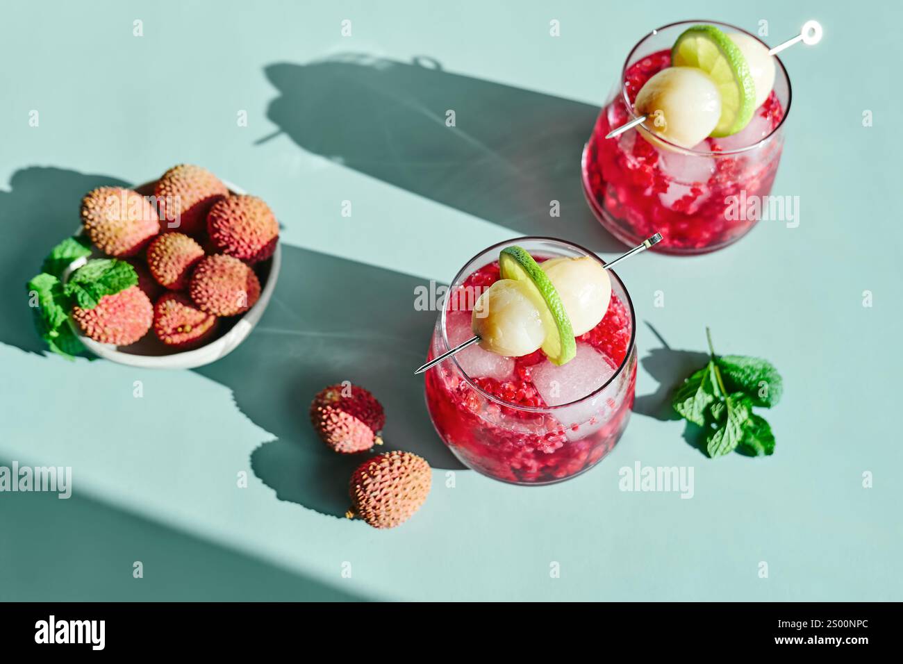 Refreshing lychee drink with raspberry, lime, mint leaves and ice. Non-alcoholic sparkling ...