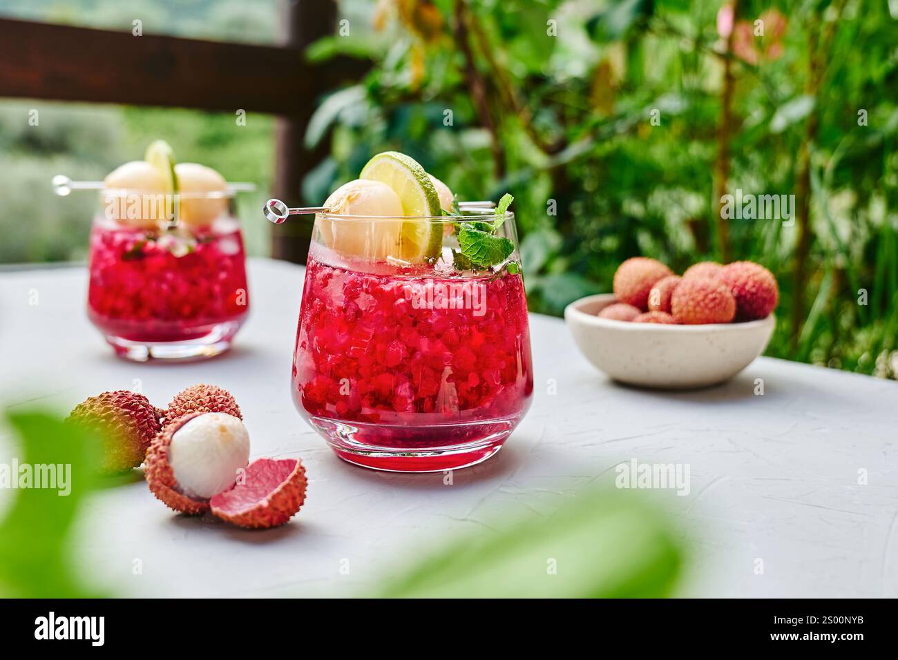 Refreshing lychee drink with raspberry, lime, mint leaves and ice. Non-alcoholic sparkling ...