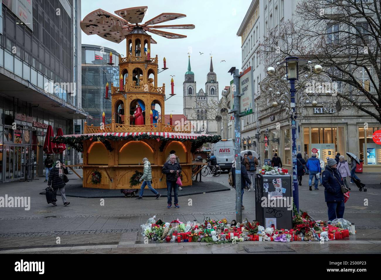 People walk at the Christmas Market, where a car drove into a crowd on ...