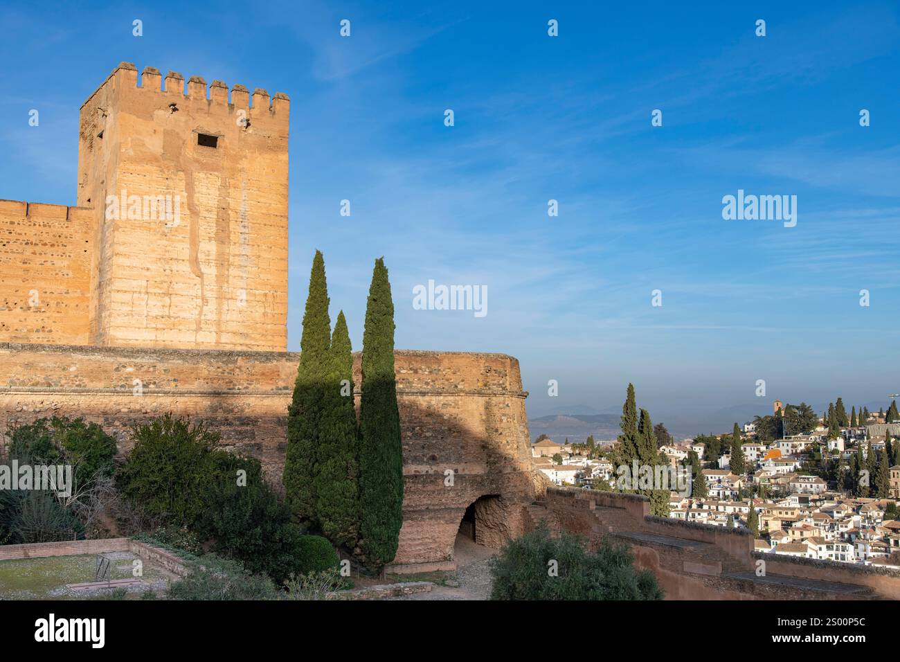 Morning sunrise on building and surrounding fortified wall and canon in ...