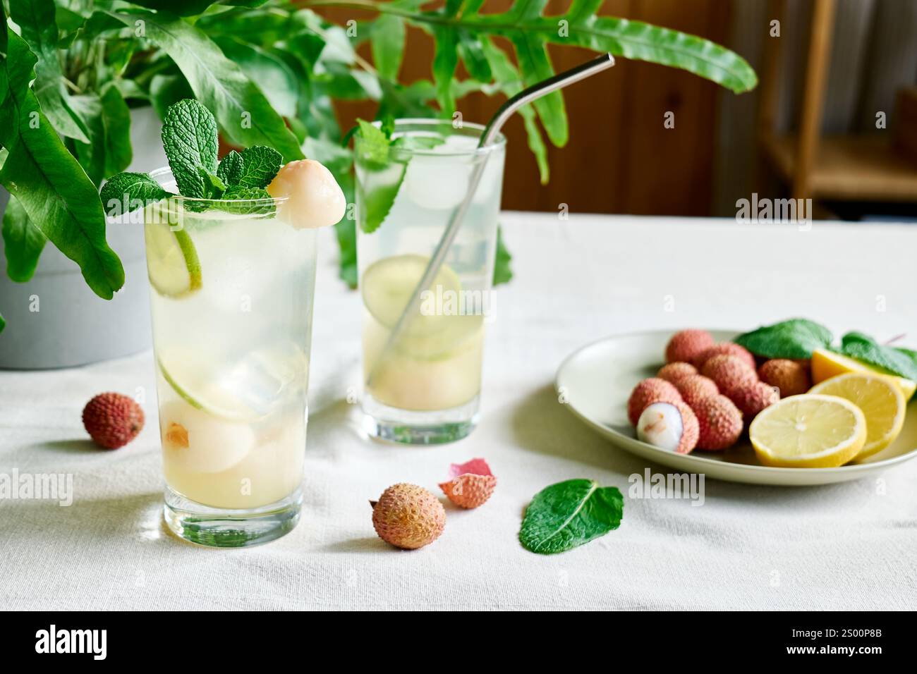 Refreshing lychee drink with lime, mint leaves and ice. Non-alcoholic sparkling cocktail fizzy ...