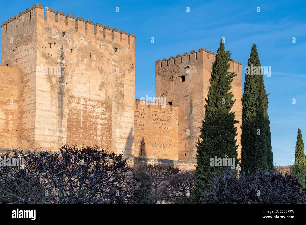 Morning sunrise on building and surrounding fortified wall and canon in ...
