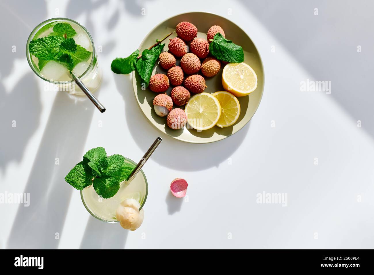 Refreshing lychee drink with lime, mint leaves and ice. Non-alcoholic sparkling cocktail fizzy ...