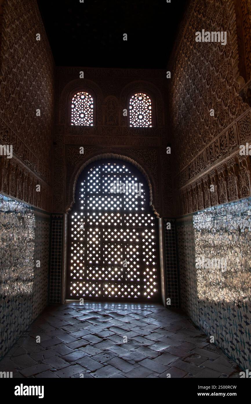 Granada, Spain-February 7, 2024; Light shining through lattice panel in ...