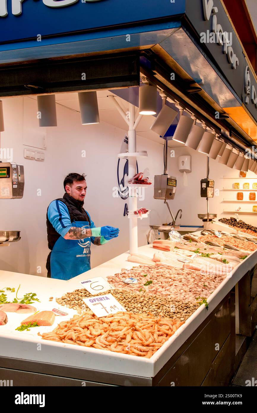 Malaga, Spain-February 8, 2024; Fishmonger in his stand at covered ...