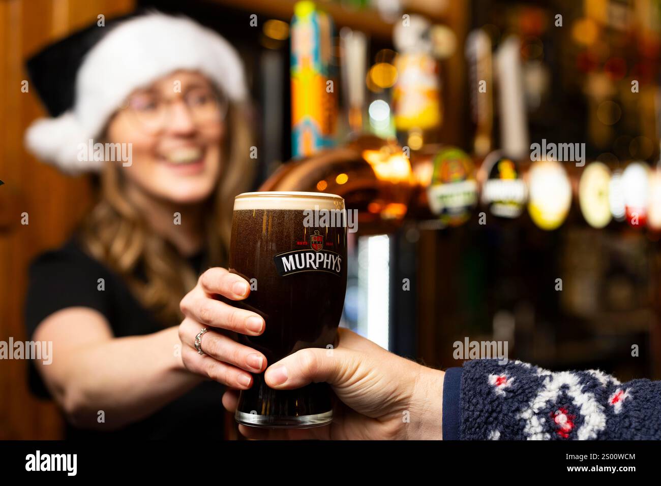 EDITORIAL USE ONLY A pint of Murphy's Irish Stout is poured after being ...
