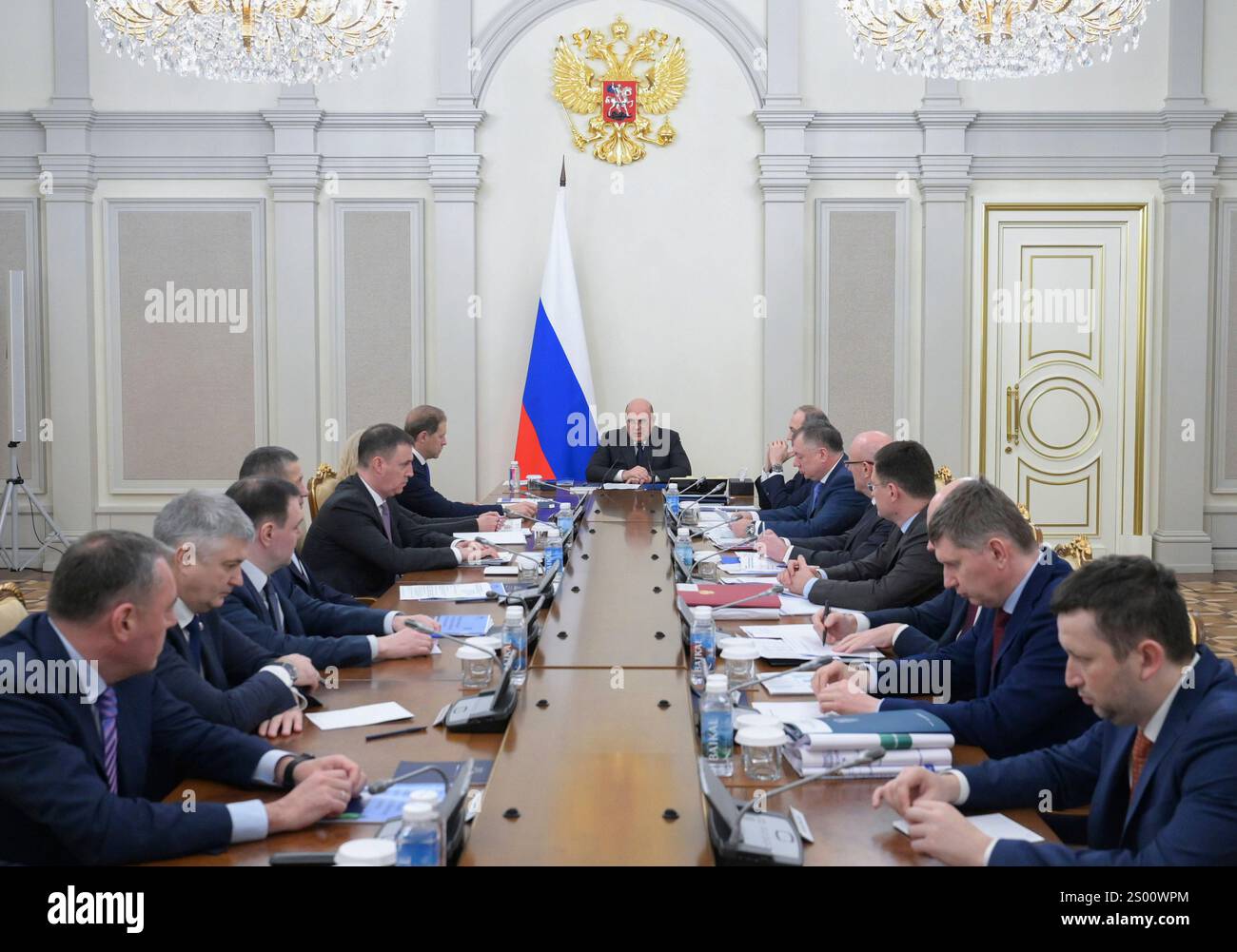 Russian Prime Minister Mikhail Mishustin chairs a meeting with his ...