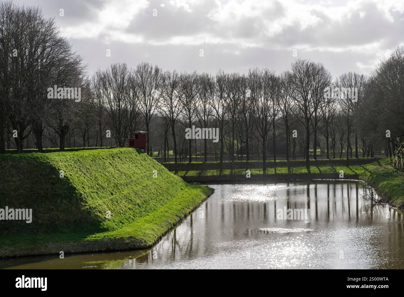 Grass overgrown rampart and canal around the village of Bourtange ...